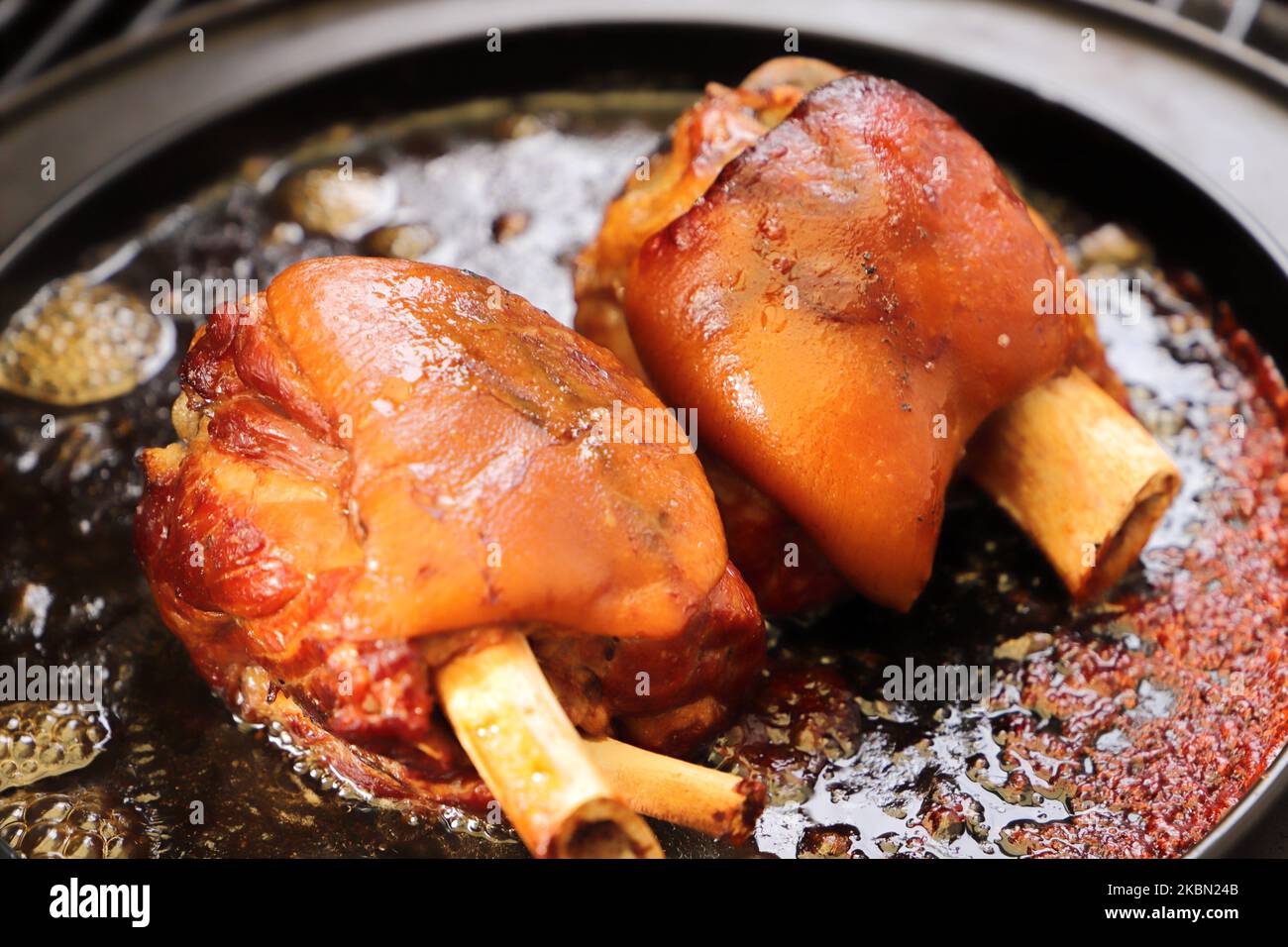 two juicy pork knuckles from the grill Stock Photo - Alamy