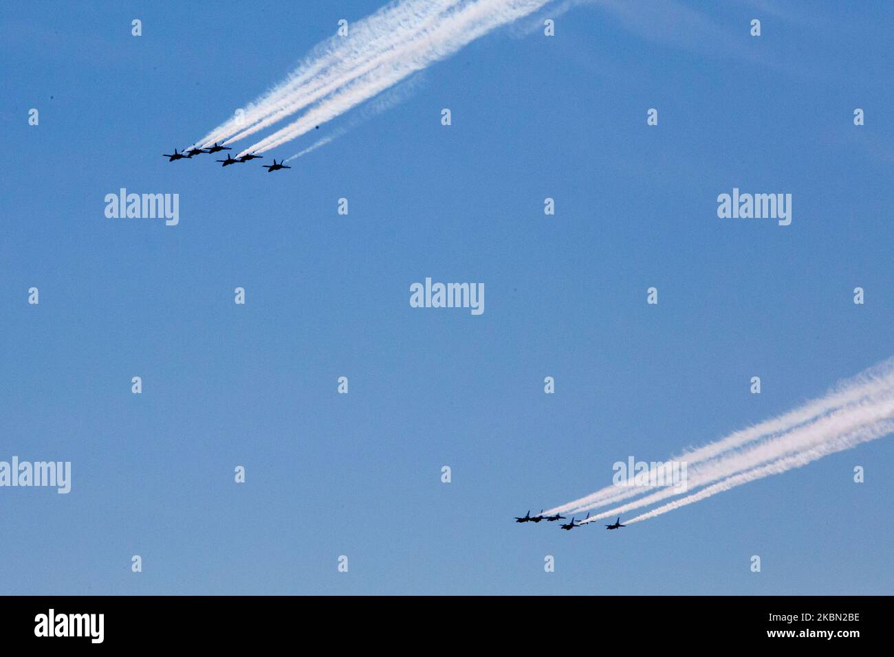 The Navy Blue Angels and Air Force Thunderbirds fly over downtown ...