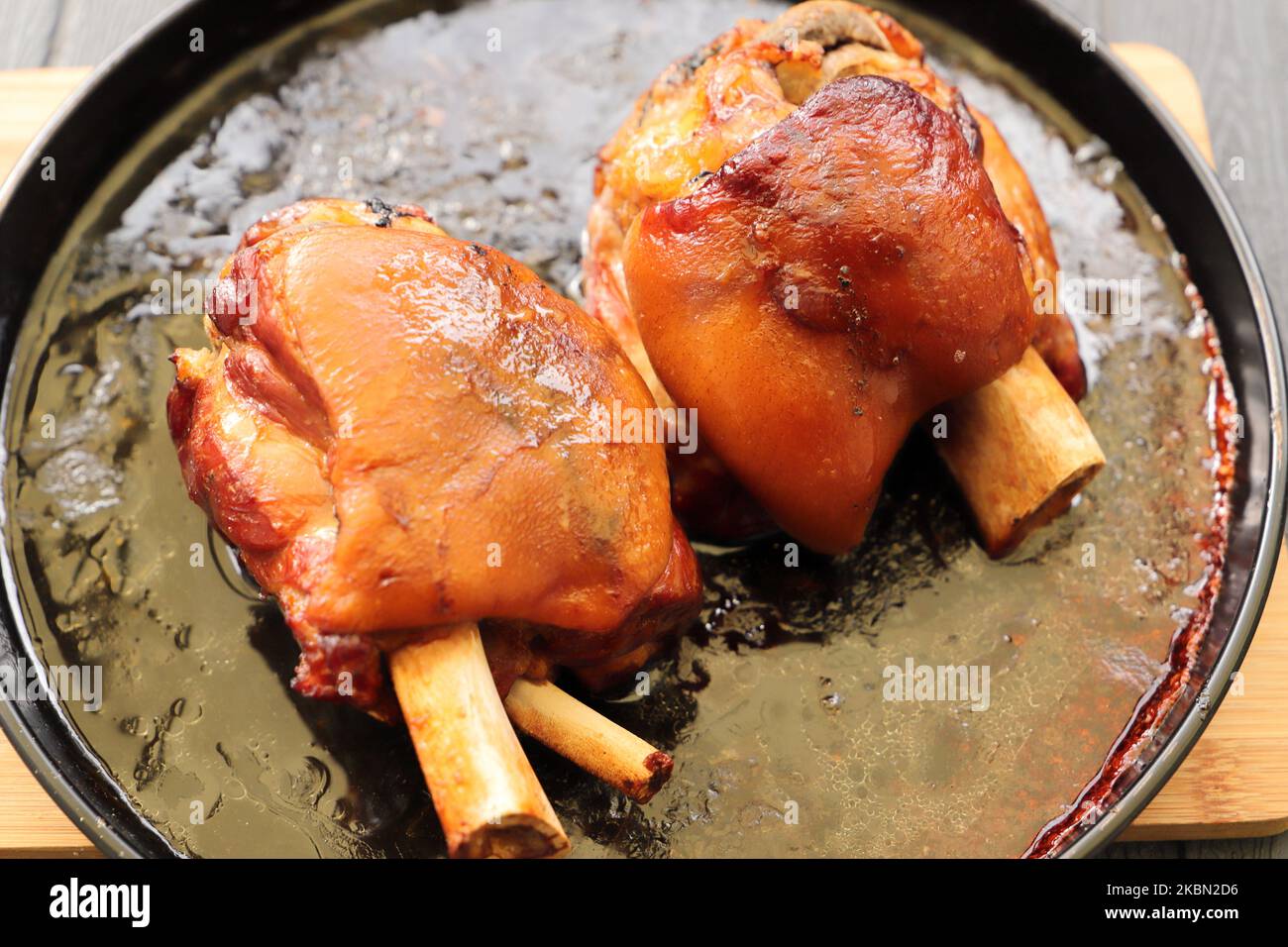 two juicy pork knuckles from the grill Stock Photo - Alamy