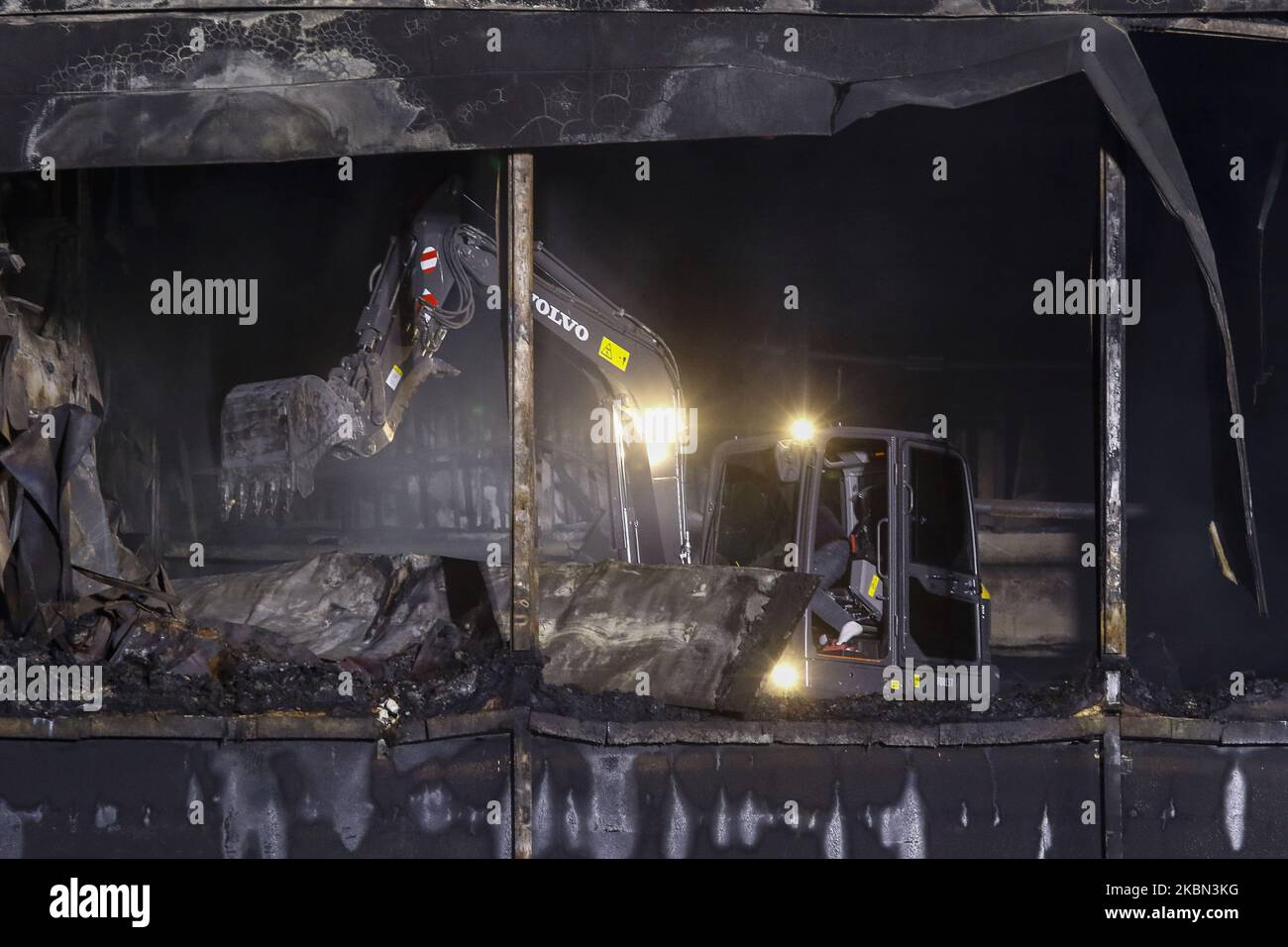 Firefighters carry out a search and rescue operation at the site of a ...