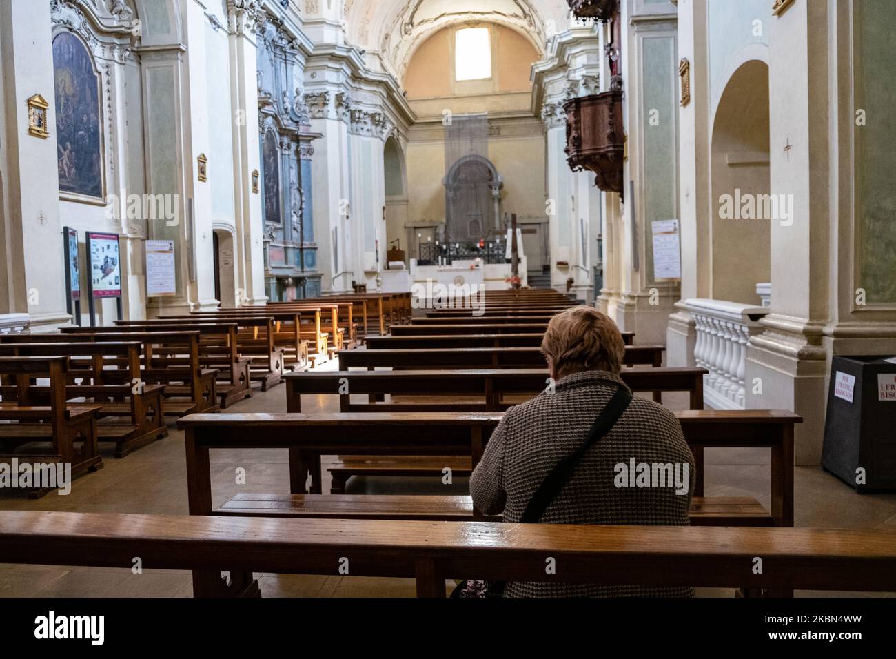 woman praying in the Sanctuary of the Eucharistic Miracle, famous all ...