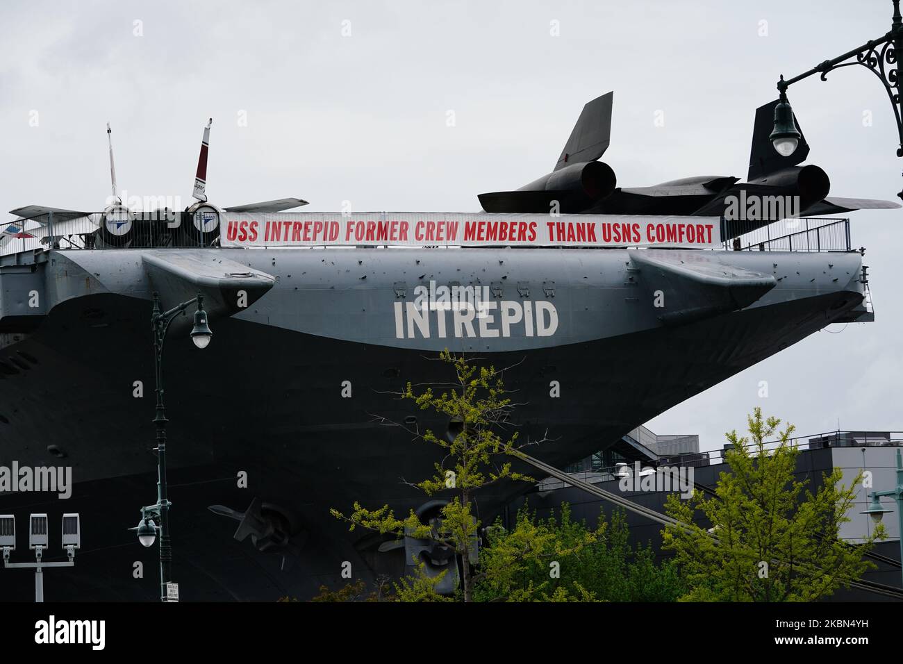 A view of the USS Intrepid with sign,”USS Intrepid Former Crew Members ...