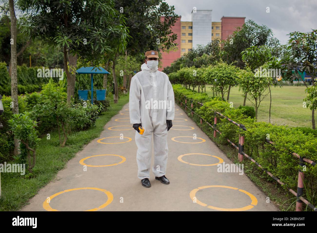 A security in charge is ready for his duty in garment factory in Dhaka ...