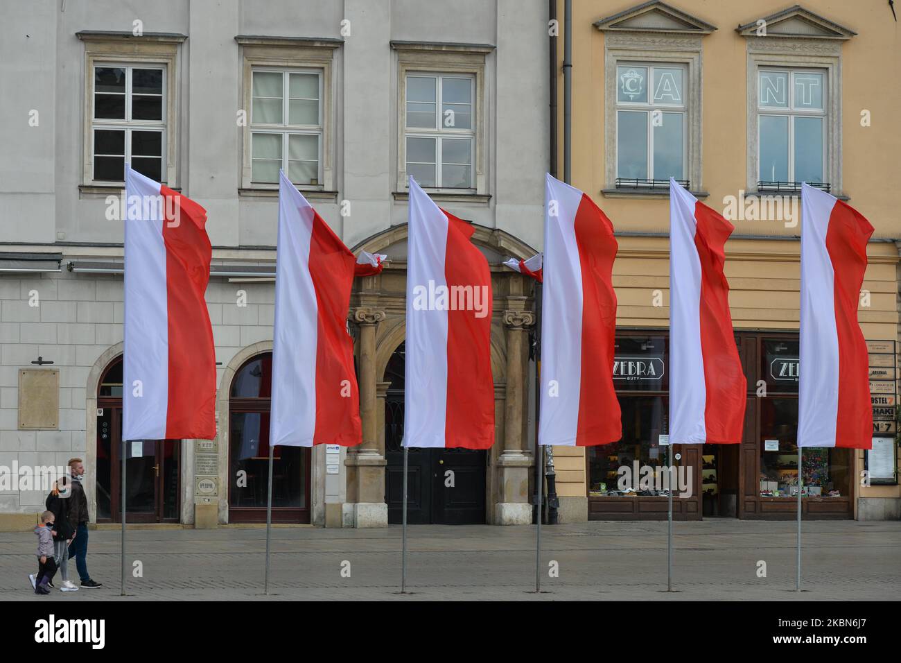 Polish national flags seen on Rynek, Krakow's Main Market Square, on ...