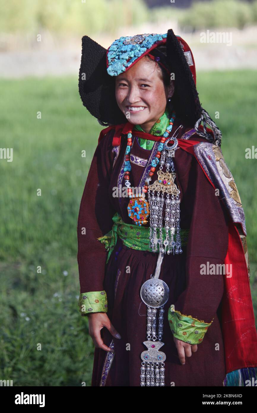 Ladakhi woman wearing in a traditional outfit with a turquoise studded ...