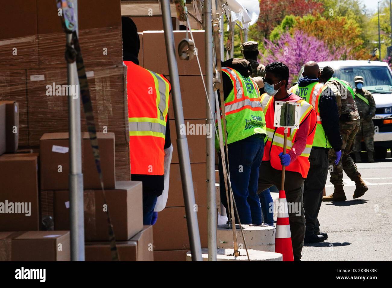 A view NYC City personnels and US Army distributing relief goods at Al ...