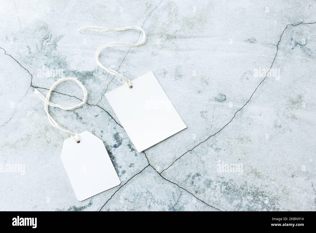 Rectangle tag mockup, square tag mockup with white cord on concrete ...
