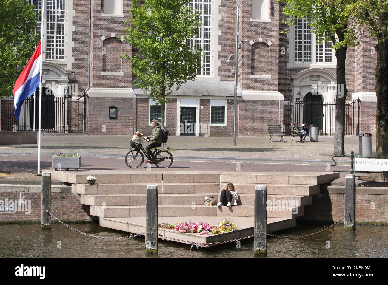 Locals residents and flowers placed are seen at the Homomonument during ...