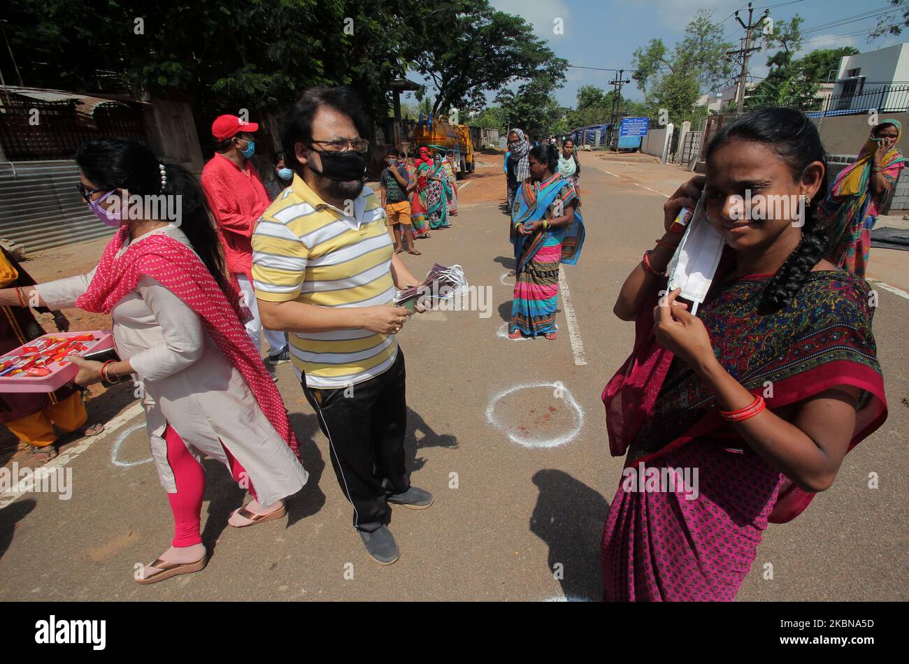 Social workers distributing sensitization items to the slum people to fight against the CIVID-19 ...