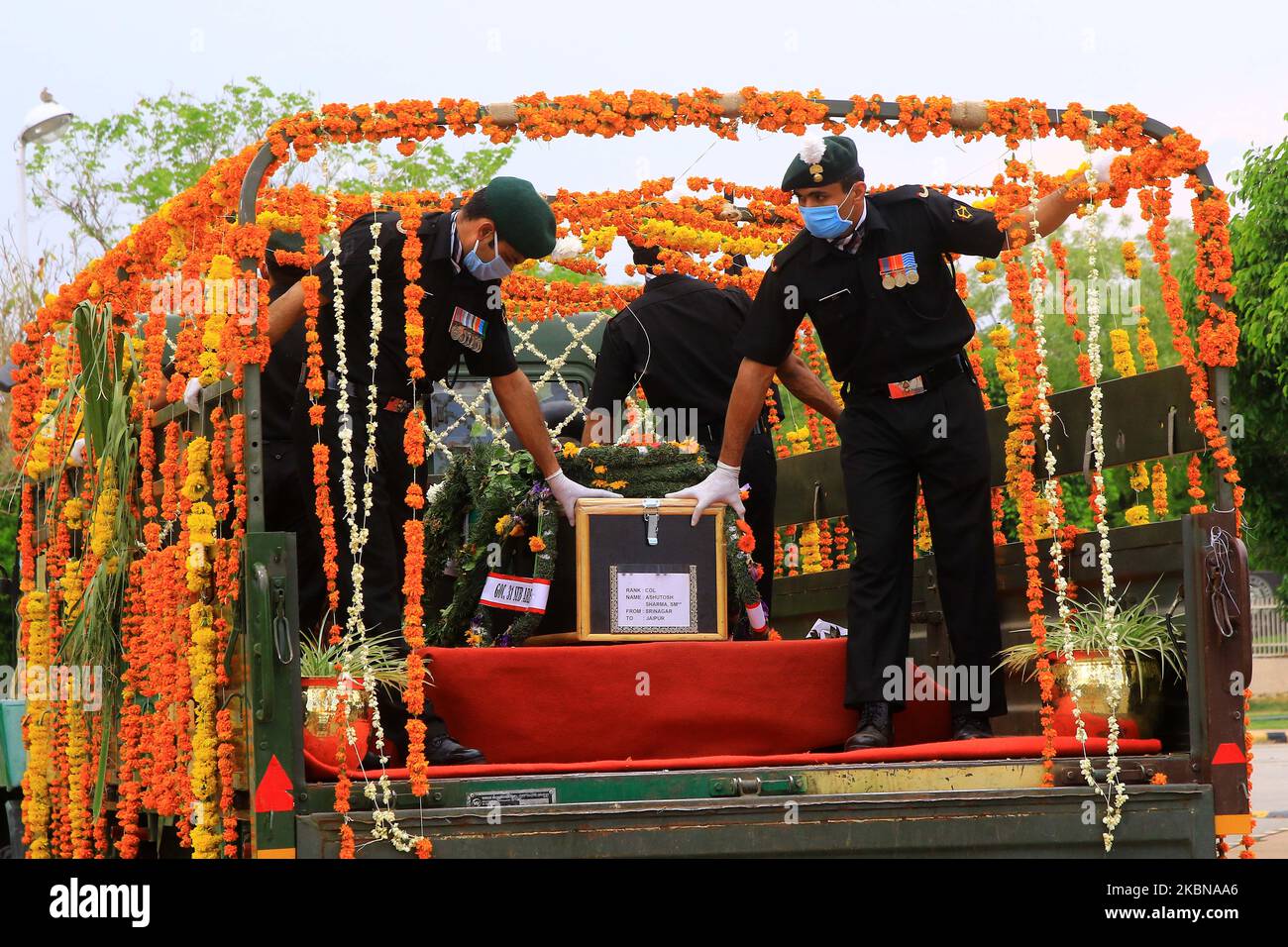 A coffin containing the mortal remains of Colonel Ashutosh Sharma , who ...