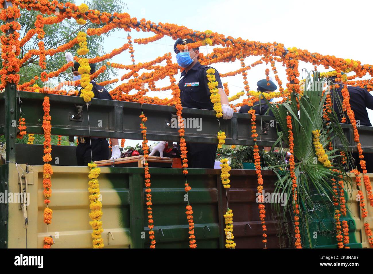 A coffin containing the mortal remains of Colonel Ashutosh Sharma , who ...