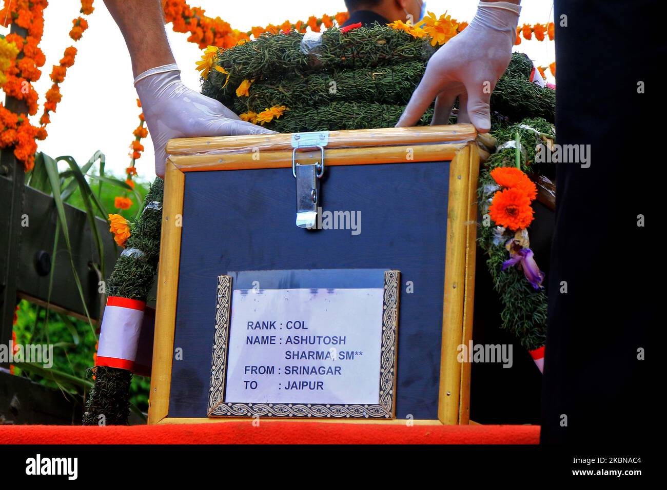 A coffin containing the mortal remains of Colonel Ashutosh Sharma , who ...