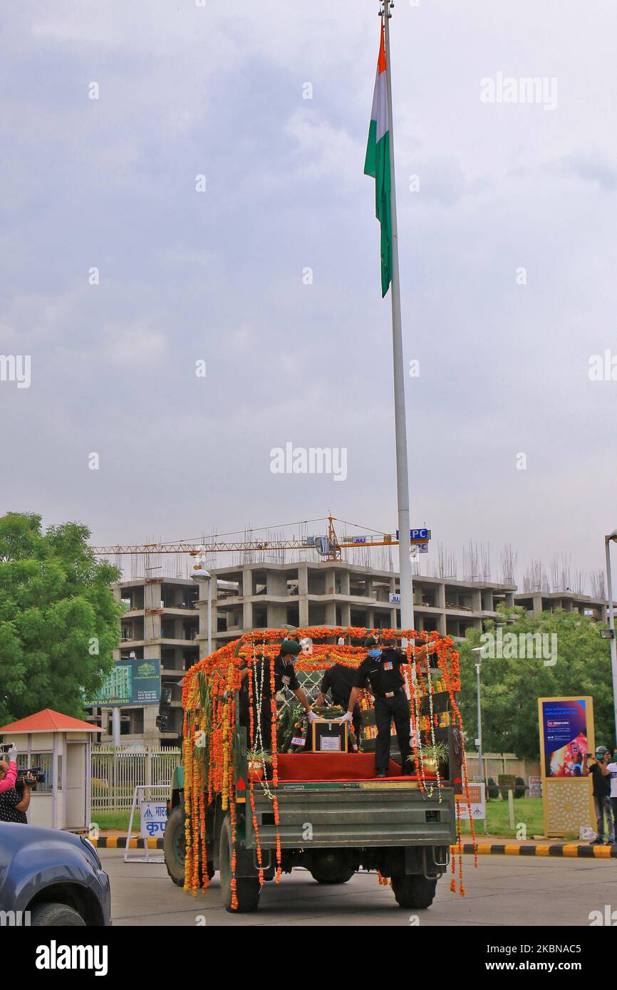 A coffin containing the mortal remains of Colonel Ashutosh Sharma , who ...