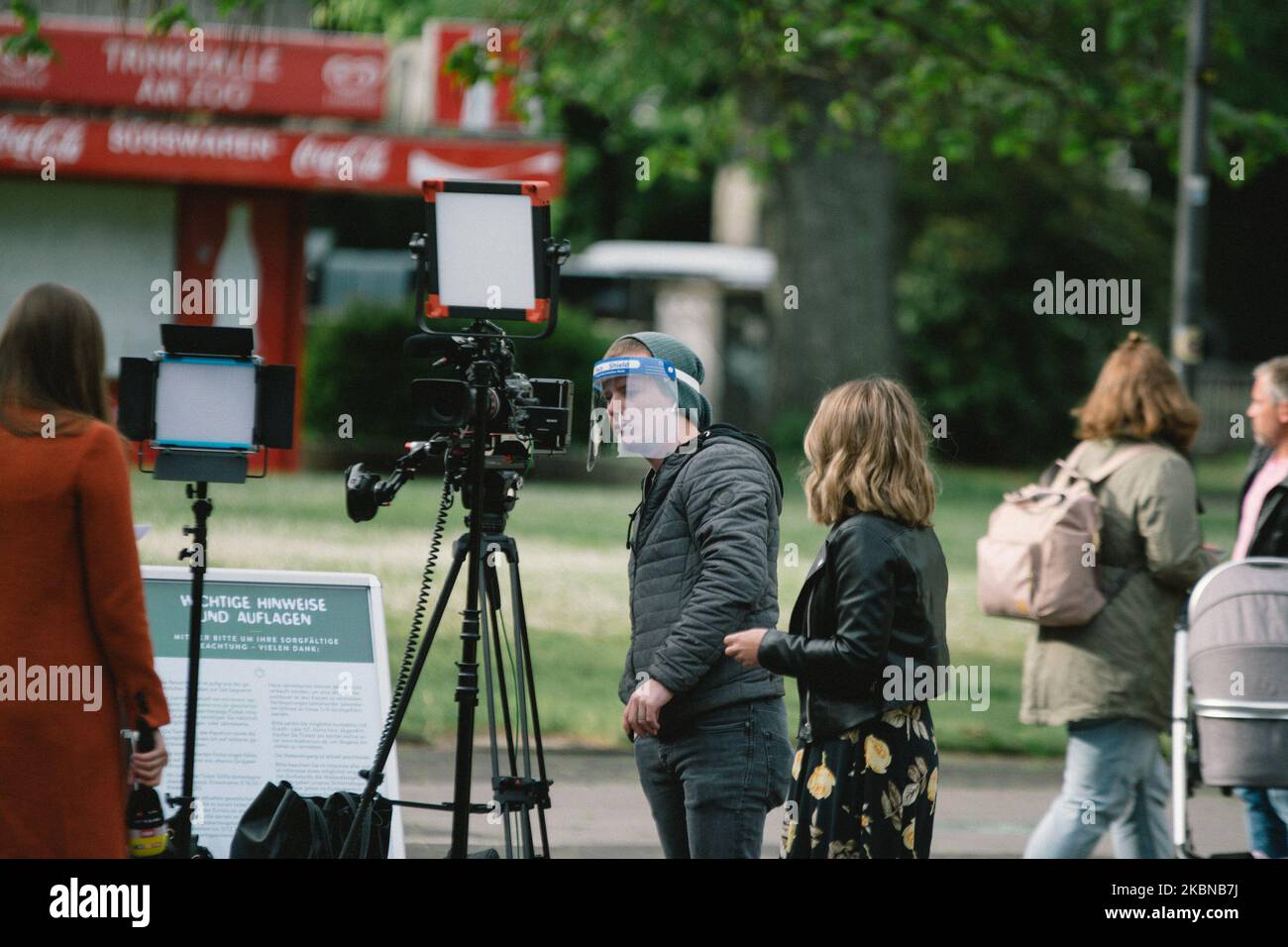 WDR TV crew is seen with plastic masks at the entrance of Cologne Zoo ...