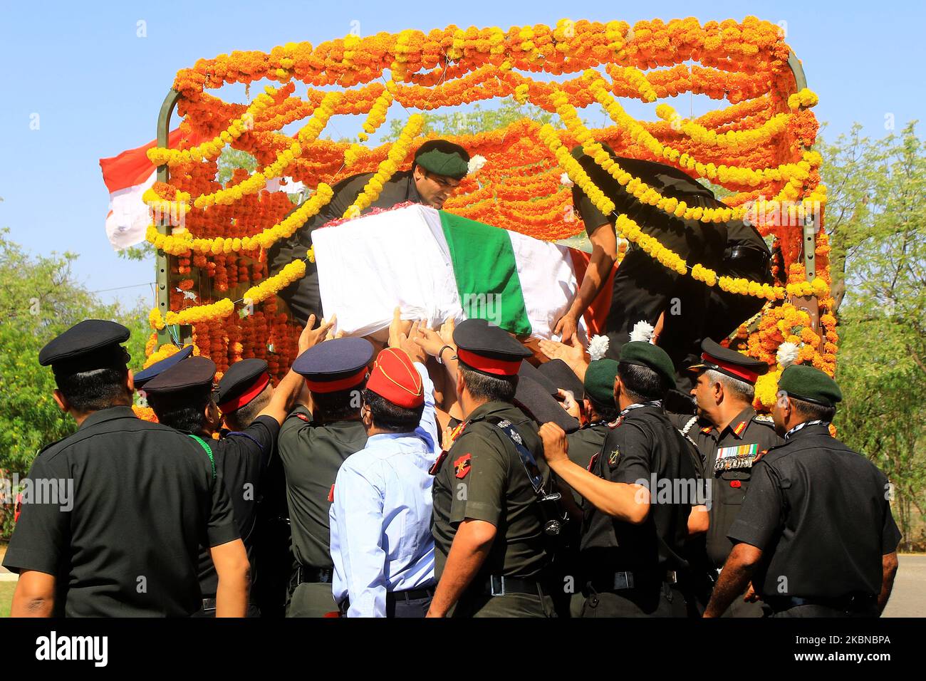 Army personnel carry mortal remains of Colonel. Ashutosh Sharma during ...