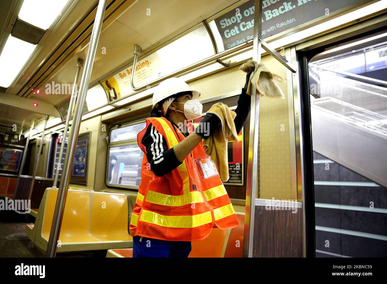 A cleaning contractor disinfects a New York City subway car , in New ...