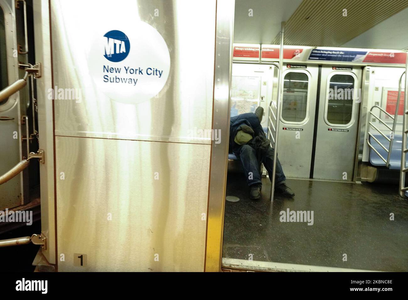 A view of a homeless person sleeping on a subway train in Hudson Yards ...