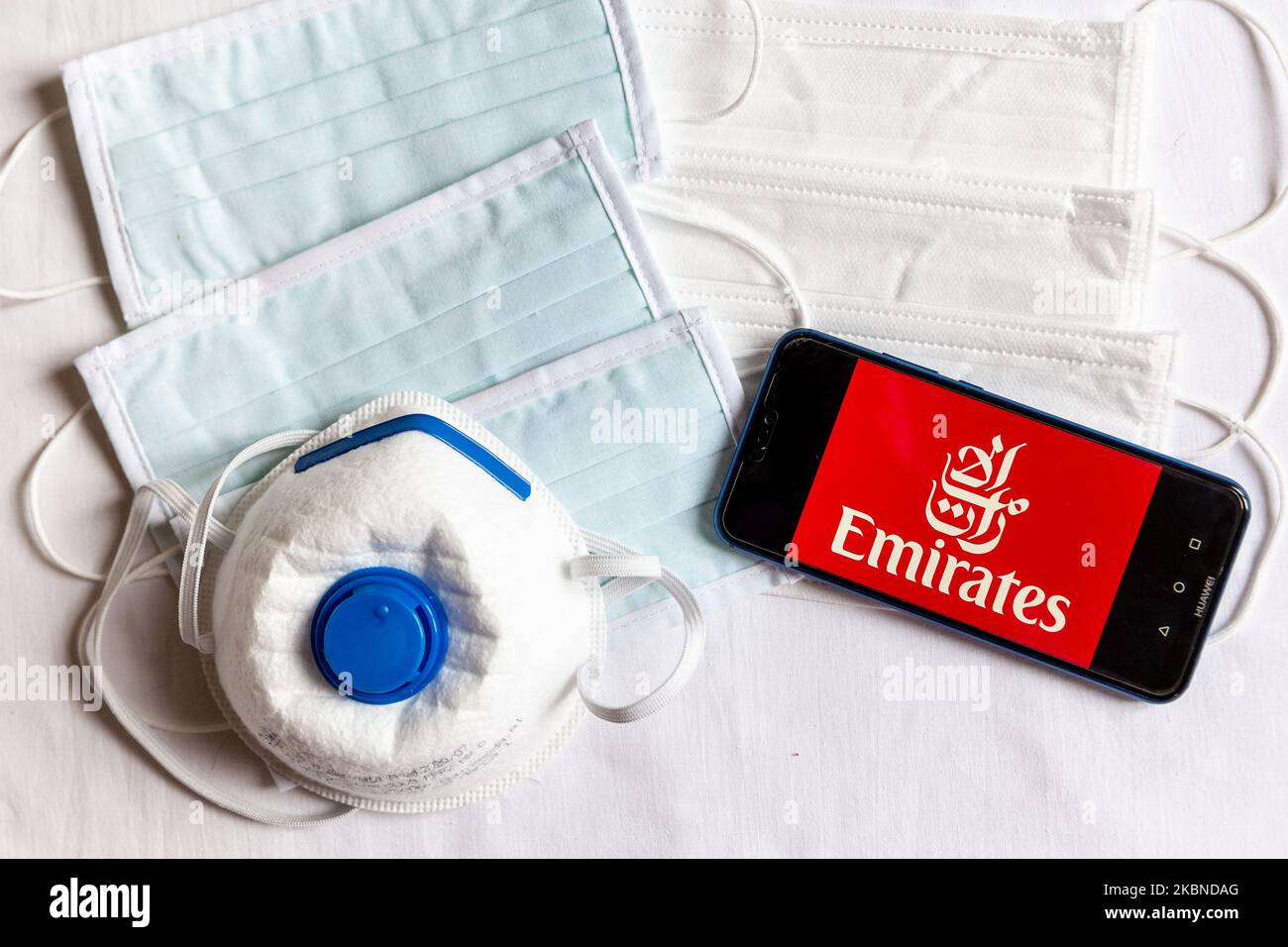 For illustrative purposes a mobile phone with a Emirates Airlines logo ...