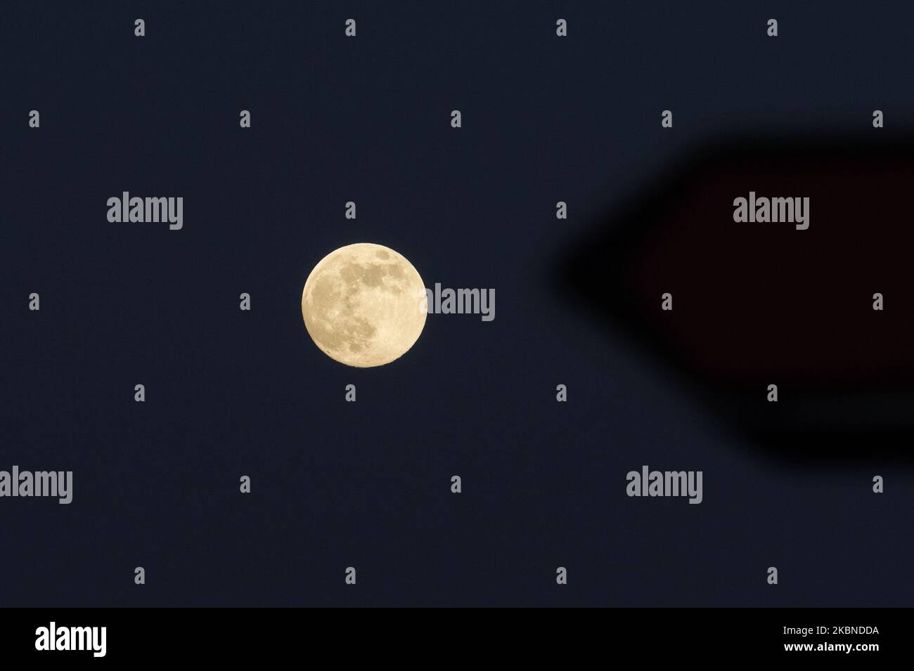 A super moon, also called full flower moon, rises above central London ...