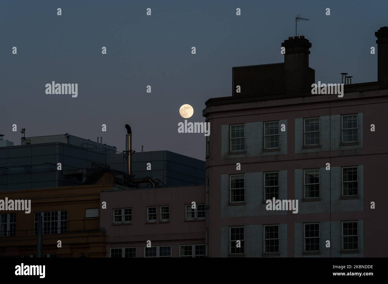 A super moon, also called full flower moon, rises above central London ...