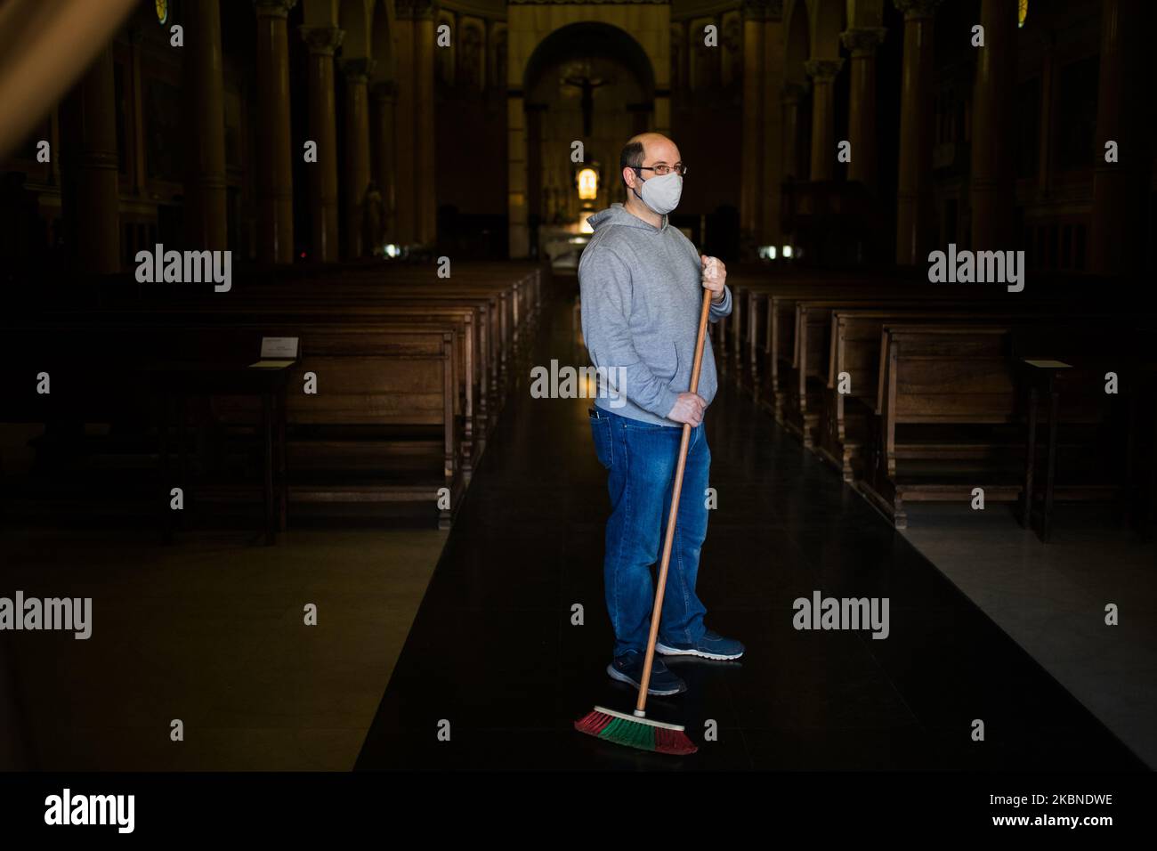Turin, Italy 29th April 2020. A portrait of person cleaning a church ...