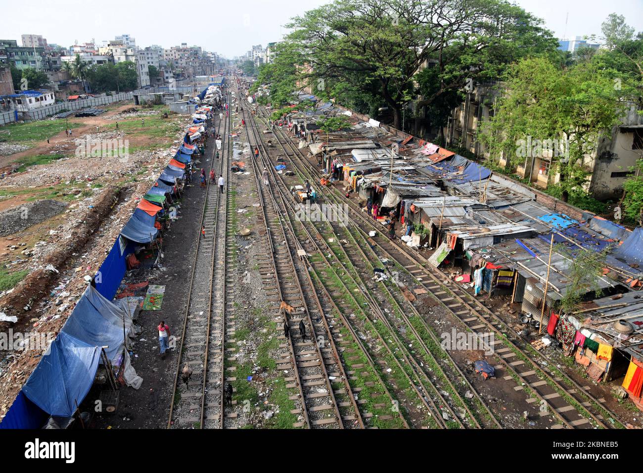 Peoples are living in the makeshift home in the slums of a next to ...