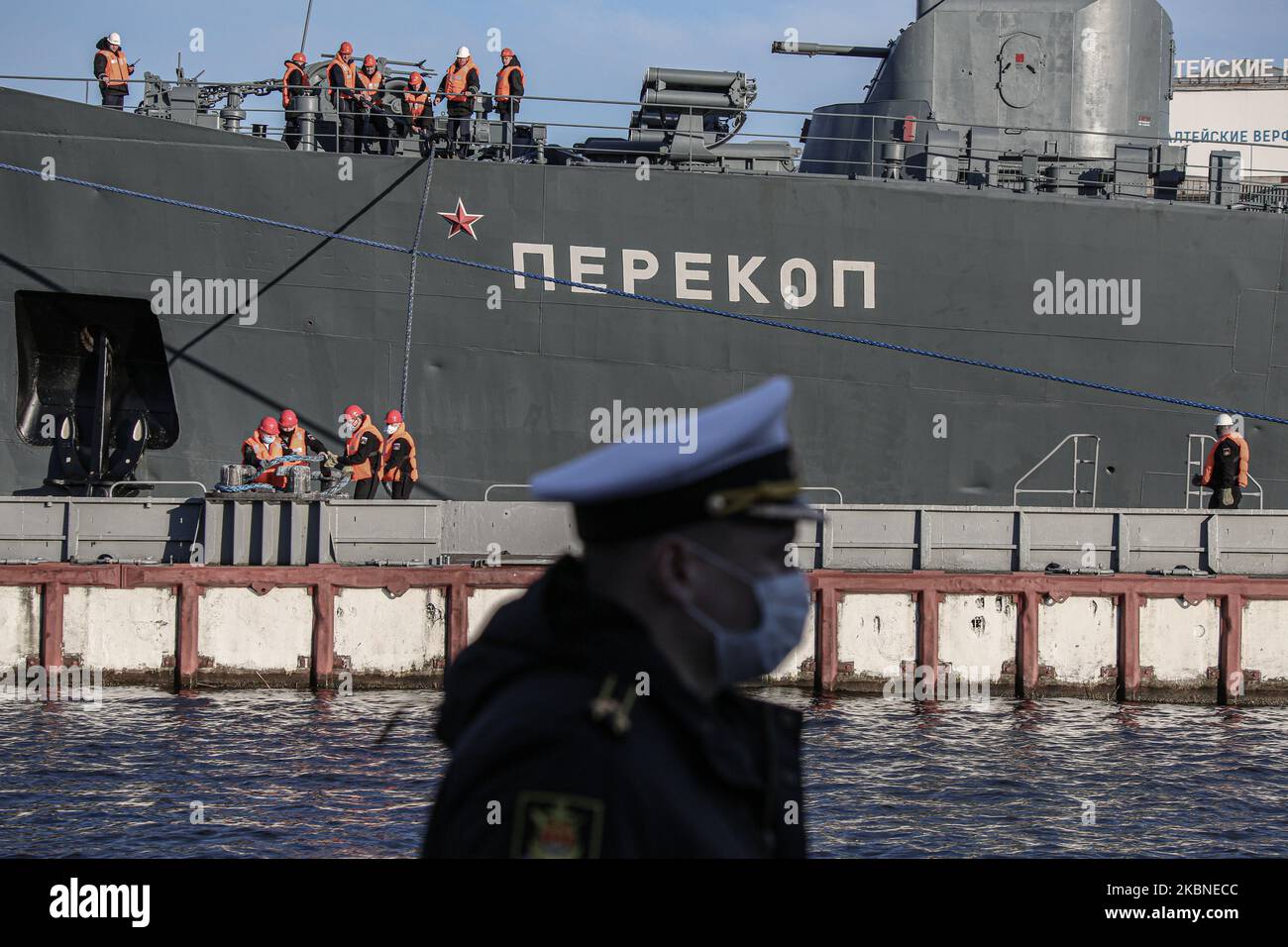 Marine officer in a protective mask walks past the military training ...