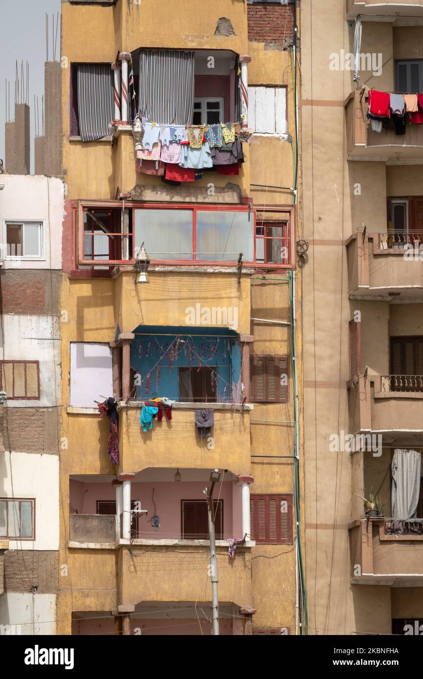 Apartment block building with bricks, balconies and reinforced concrete ...