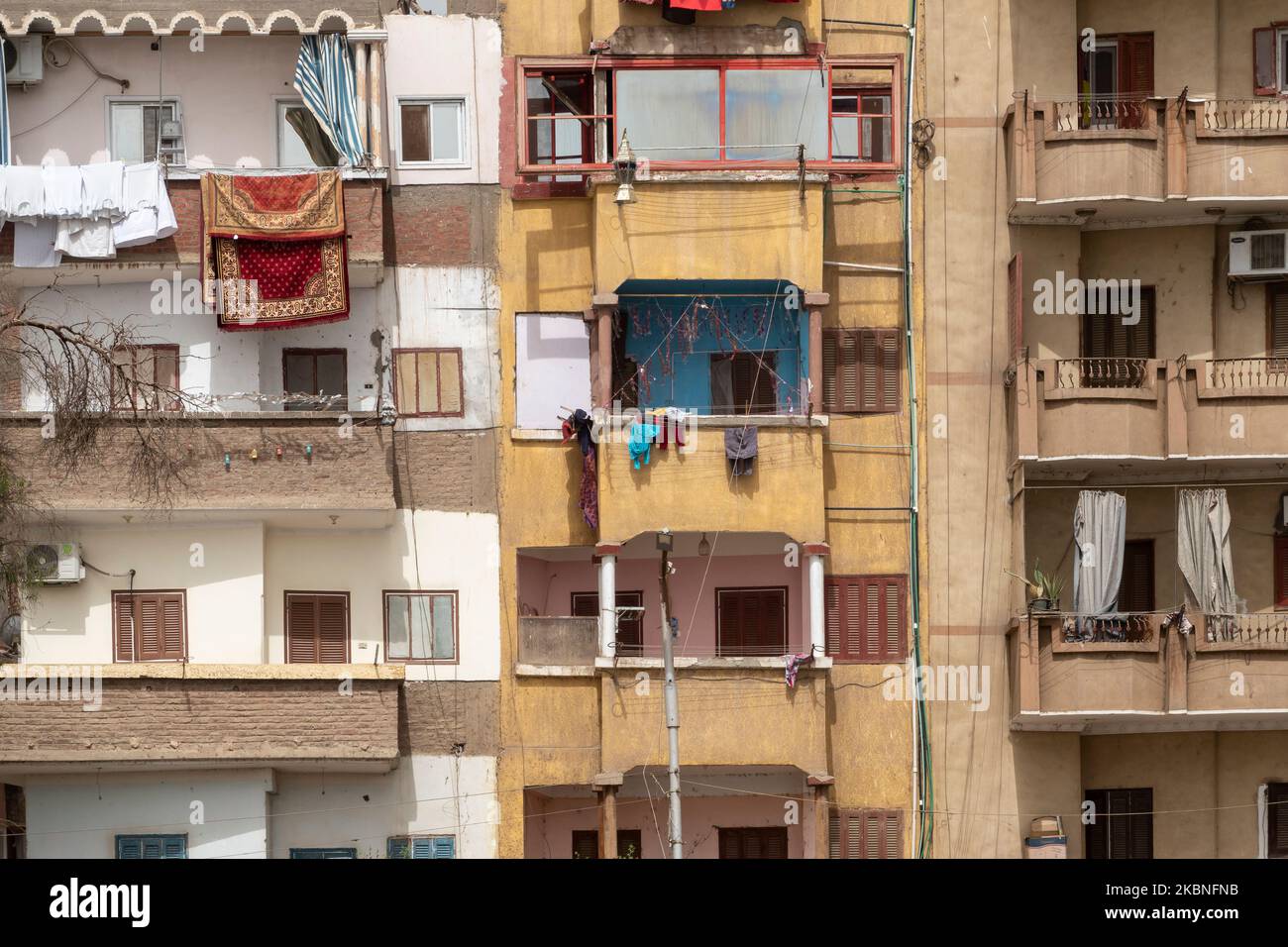 Apartment block building with bricks, balconies and reinforced concrete ...