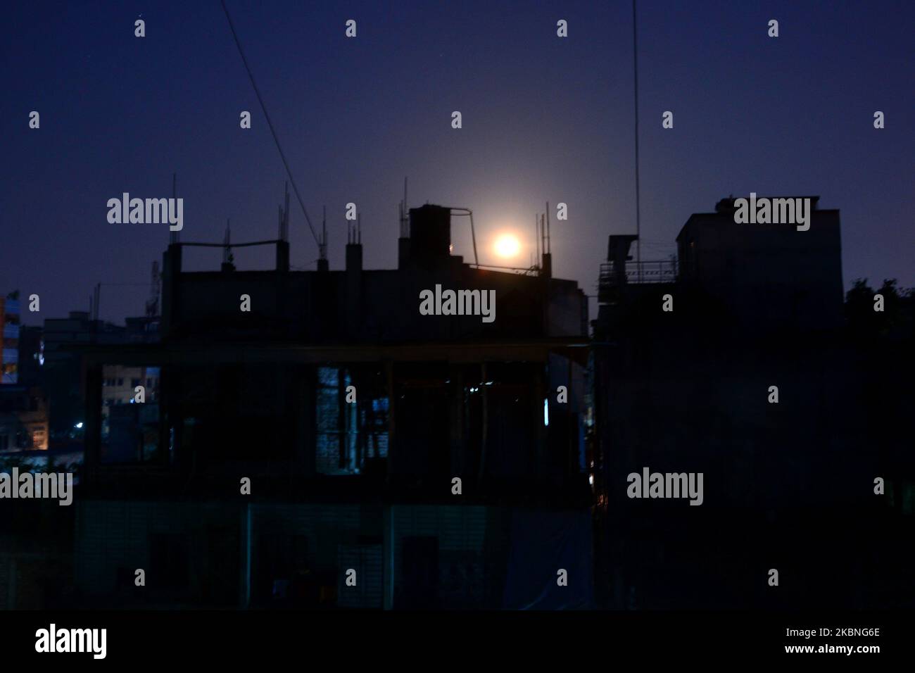 Full moon is seen in the sky over the Dhaka city in Bangladesh, on May ...