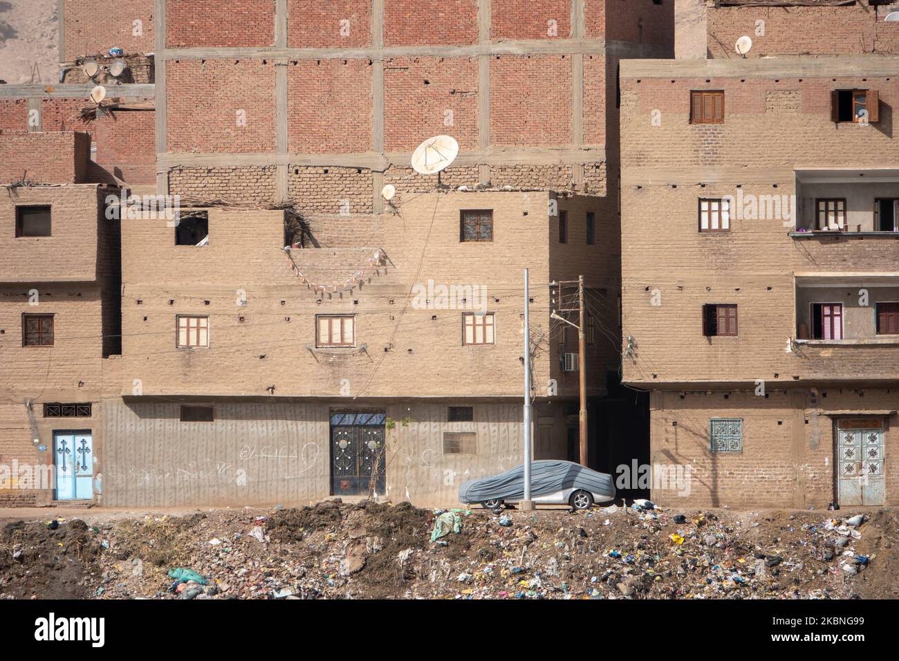 Apartment block building with bricks, balconies and reinforced concrete ...