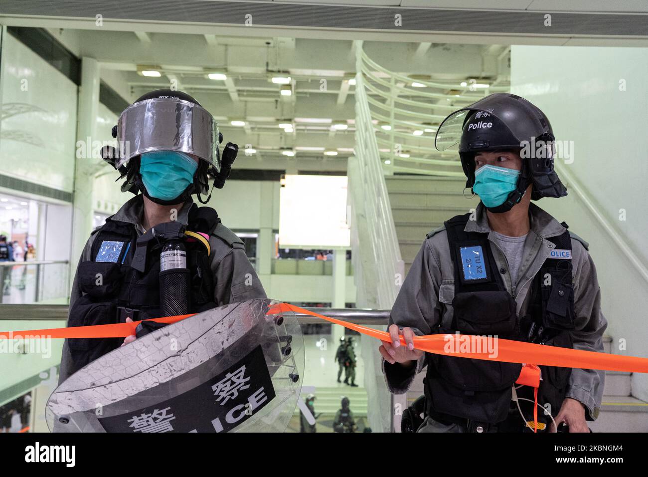 Riot police secure during an anti-government protester at the shopping ...