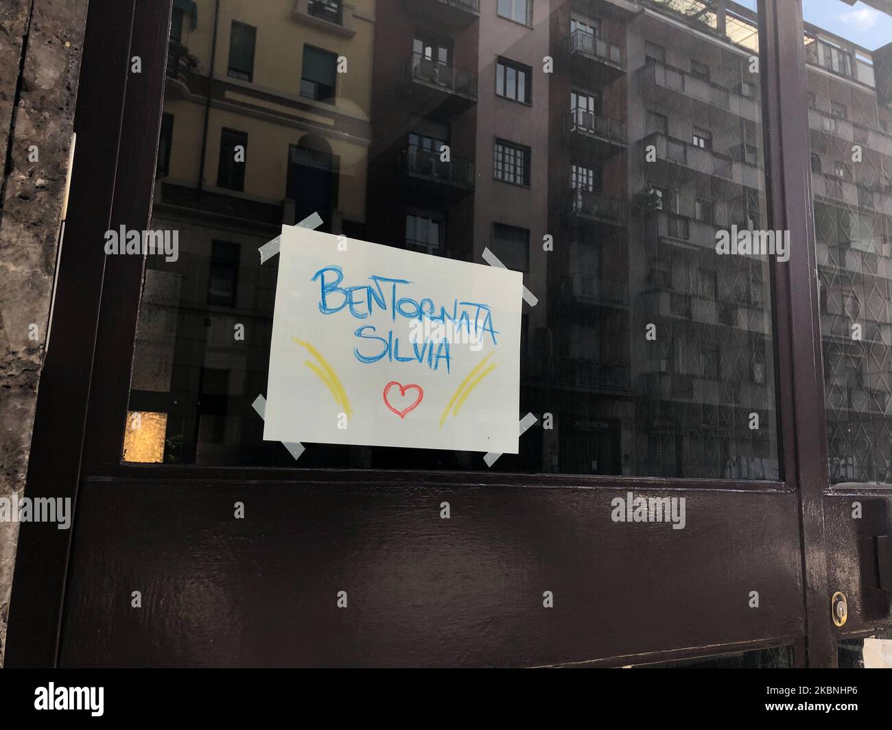 'Bentornata Silvia' (Welcome Silvia) reads a banner put on the door in ...
