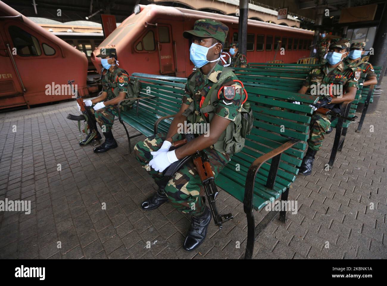 Sri Lankan Soldiers maintain social distancing while waiting for a train at Colombo, Sri Lanka ...