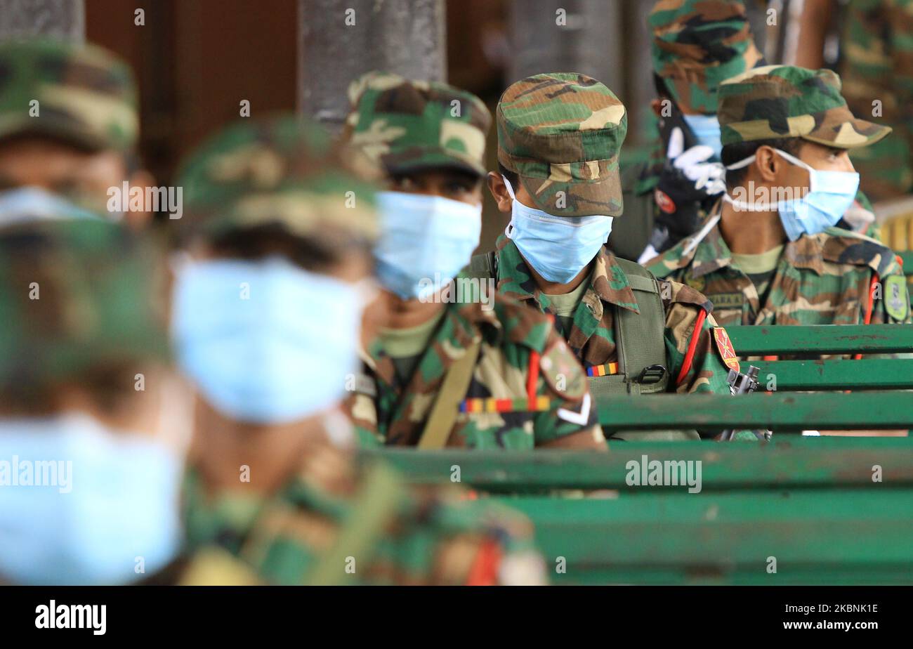 Sri Lankan Soldiers maintain social distancing while waiting for a train at Colombo, Sri Lanka ...
