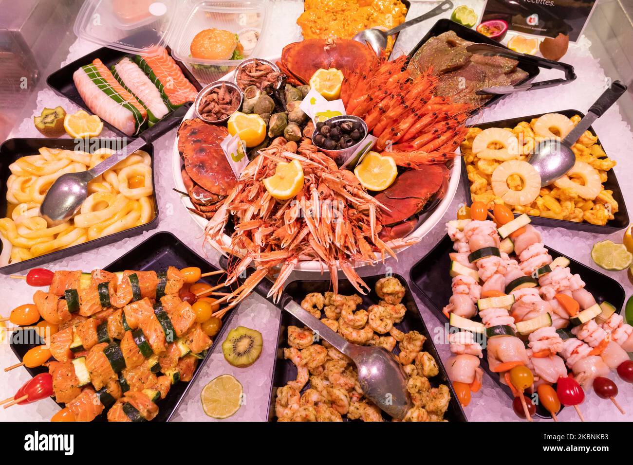 Seafood platters and ready made meals at the fish counter of a Super U ...