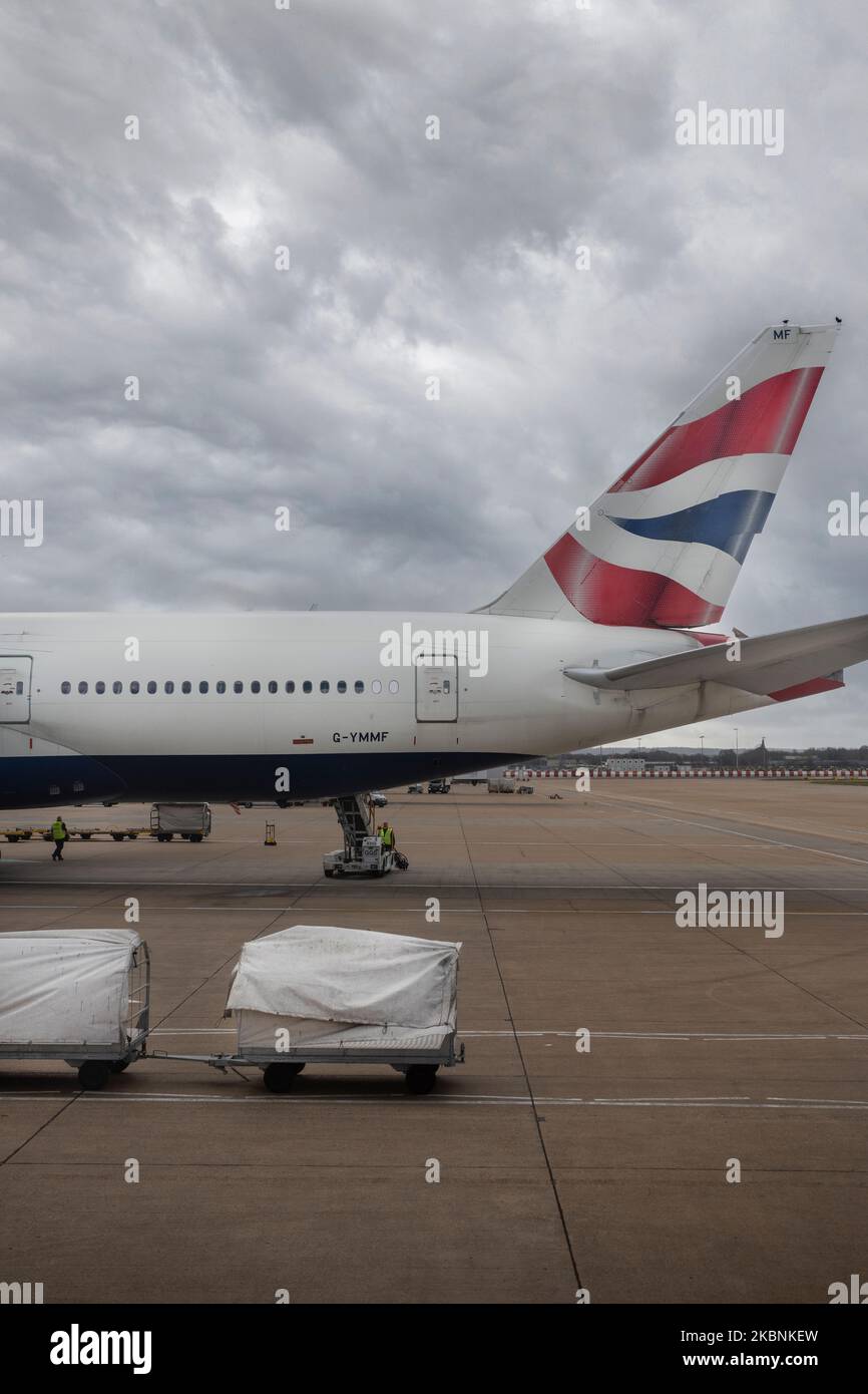 Boeing 777 aircraft sitting and apron at Gatwick Airport being loaded ...
