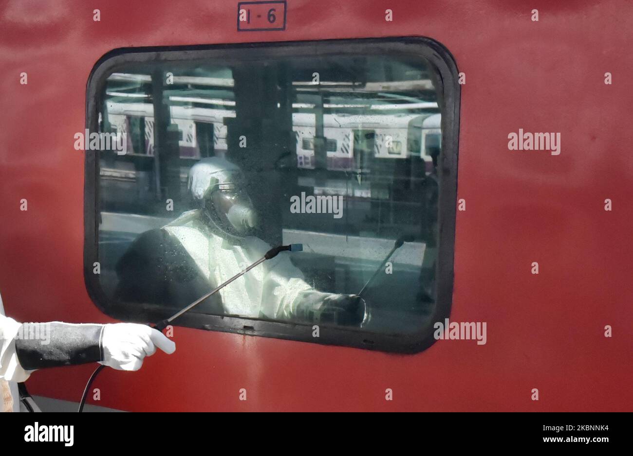 Workers wearing PPE, sanitizes the first train 02301 Howrah-New Delhi ...