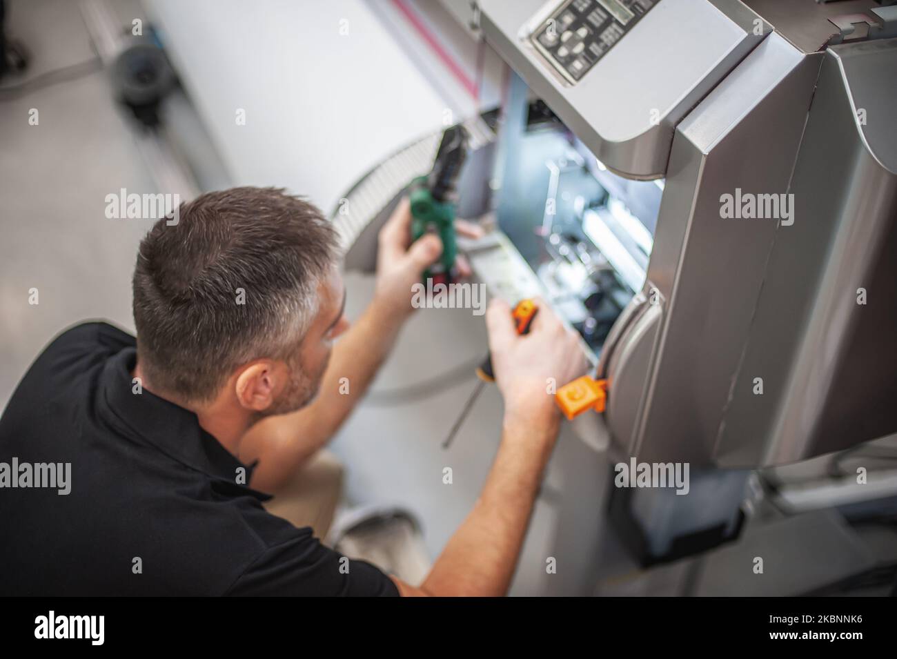 All machines nead maintains. Professional technician troubleshooting ...