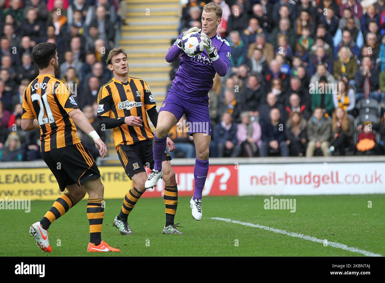 Joe Hart of Manchester City claims the ball from Shane Long and Nico ...
