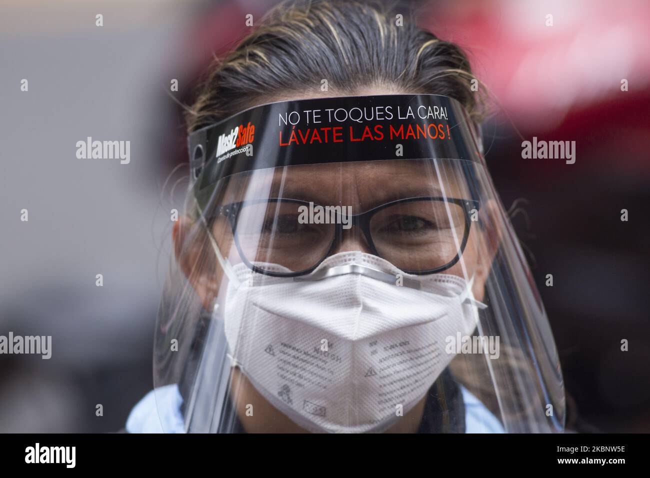 Municipal worker wearing face masks and protective glasses prepare to ...