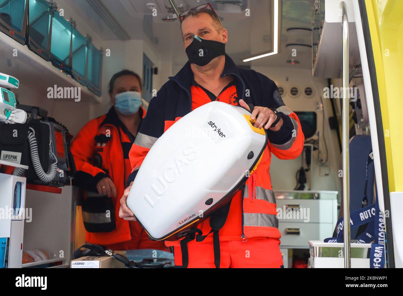 A paramedic presents LUCAS 3 chest compression system device inside new ...