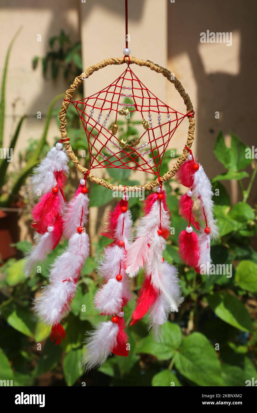 Handmade dreamcatcher hanging in a garden in Thiruvananthapuram ...