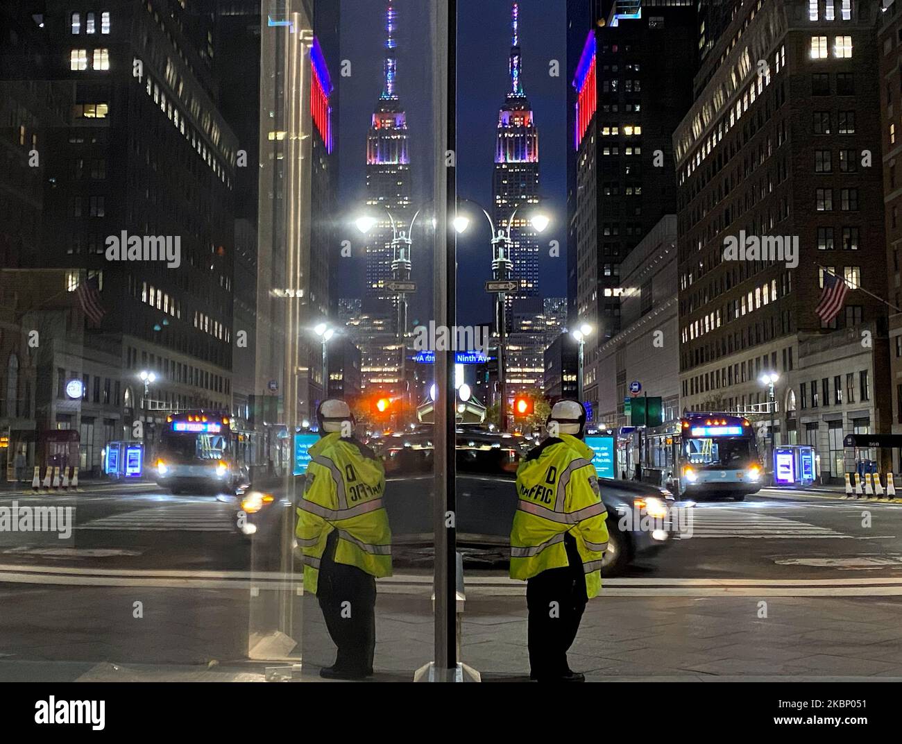 One of the essential workers, a police officer is seen with the Empire ...
