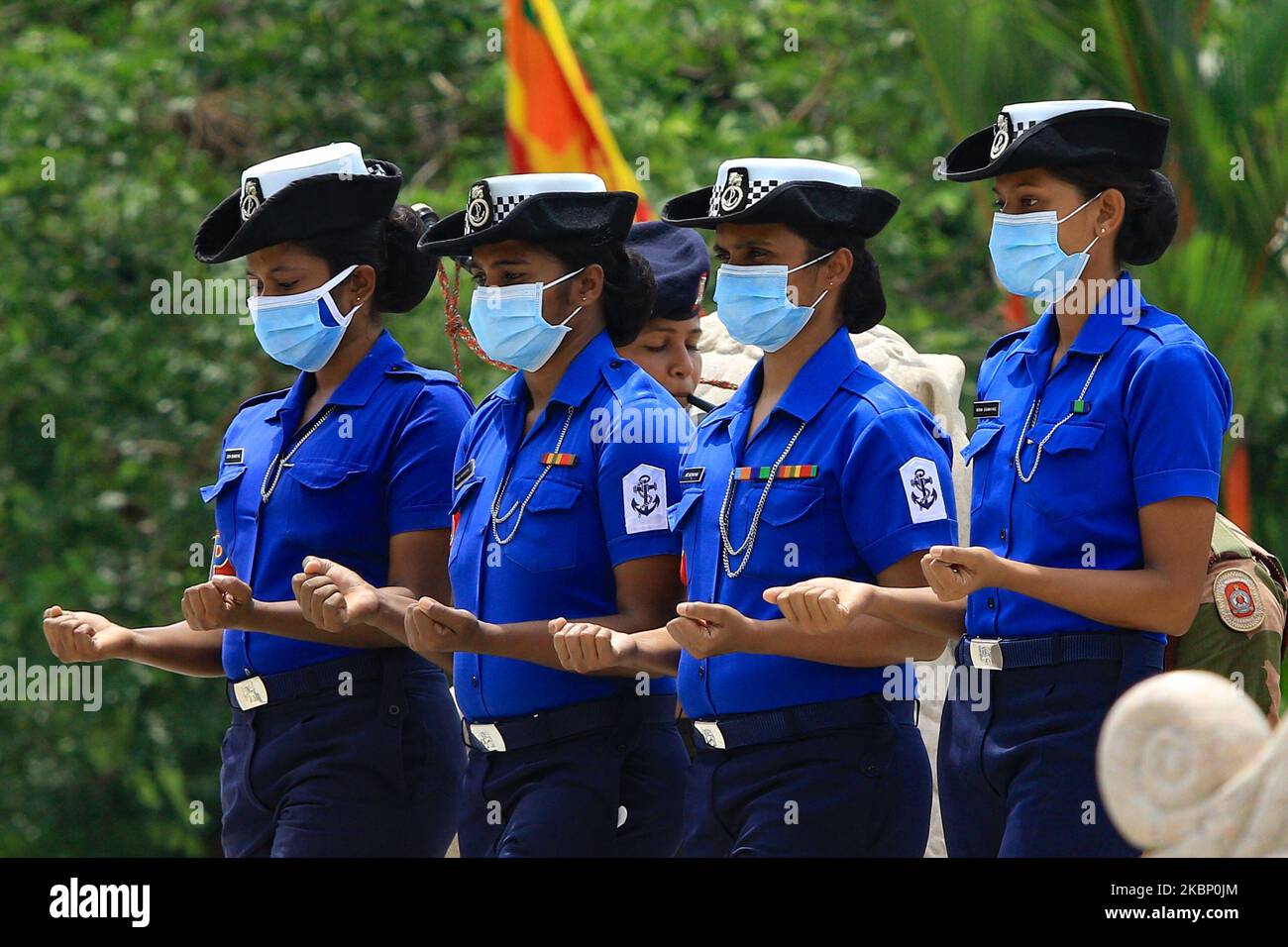 Sri Lankan women soldiers wearing protective face masks take part in a ...