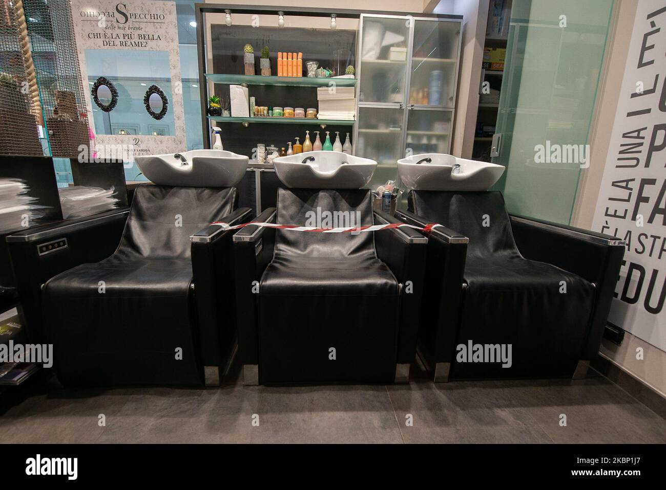 An hairdresser come back to work in L'Aquila, Italy, on May 19, 2020 ...