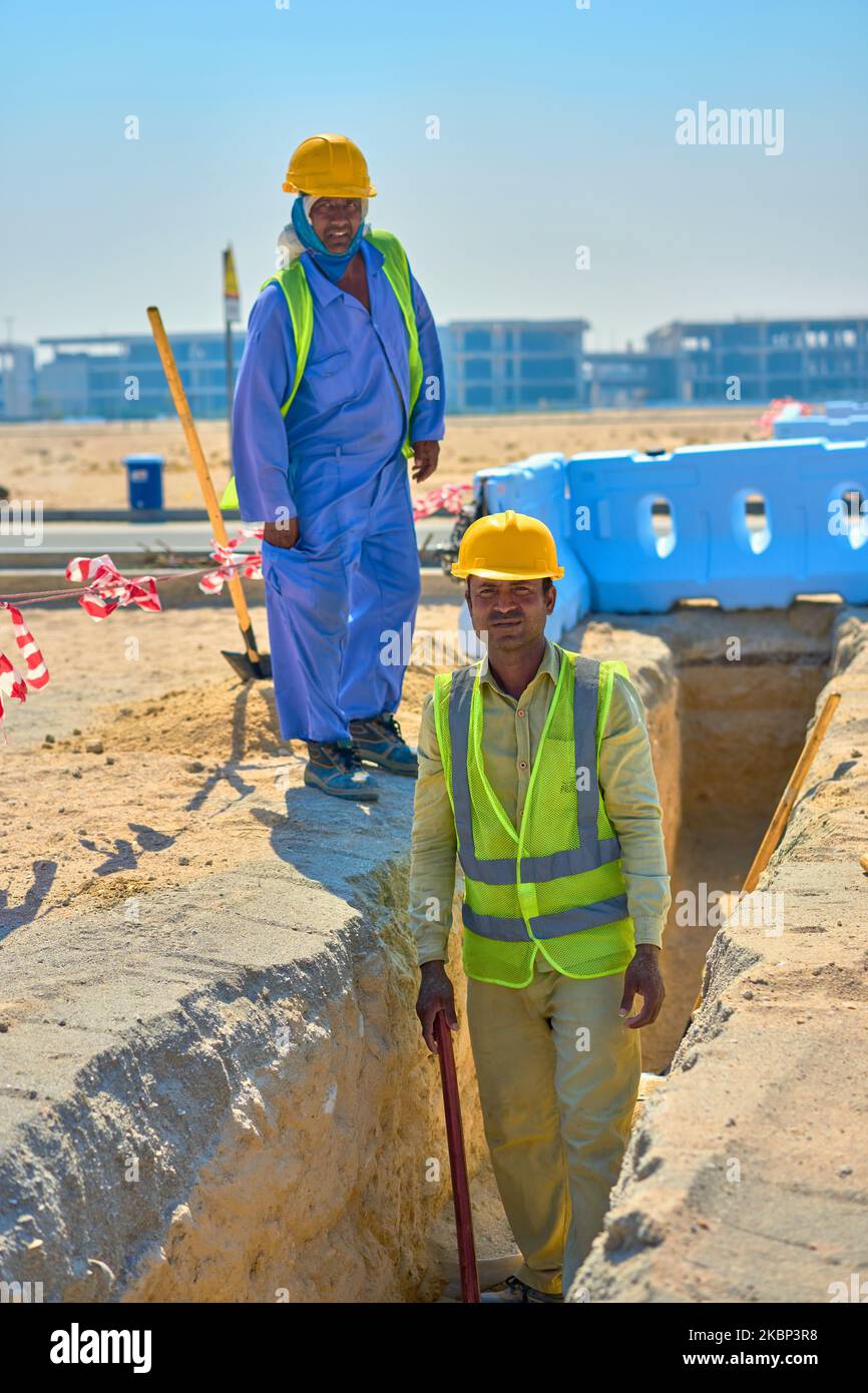 black construction workers work in the sands on the coast Stock Photo ...