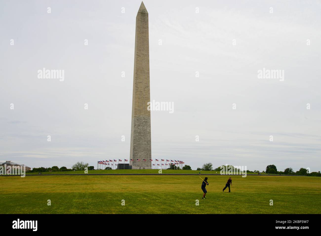 Two Washingtonians play baseball on the empty, and closed, mall in ...