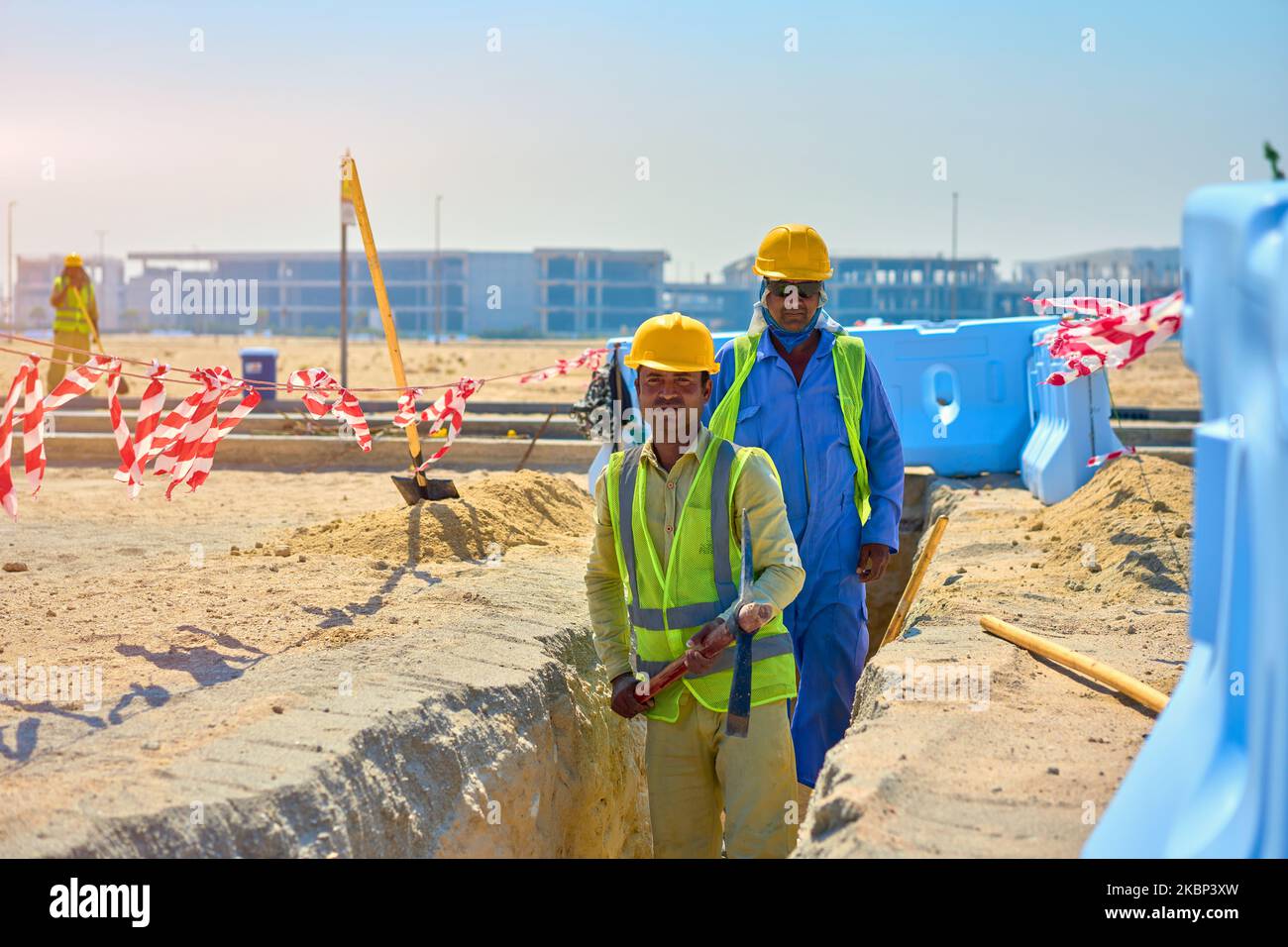 black construction workers work in the sands on the coast Stock Photo ...