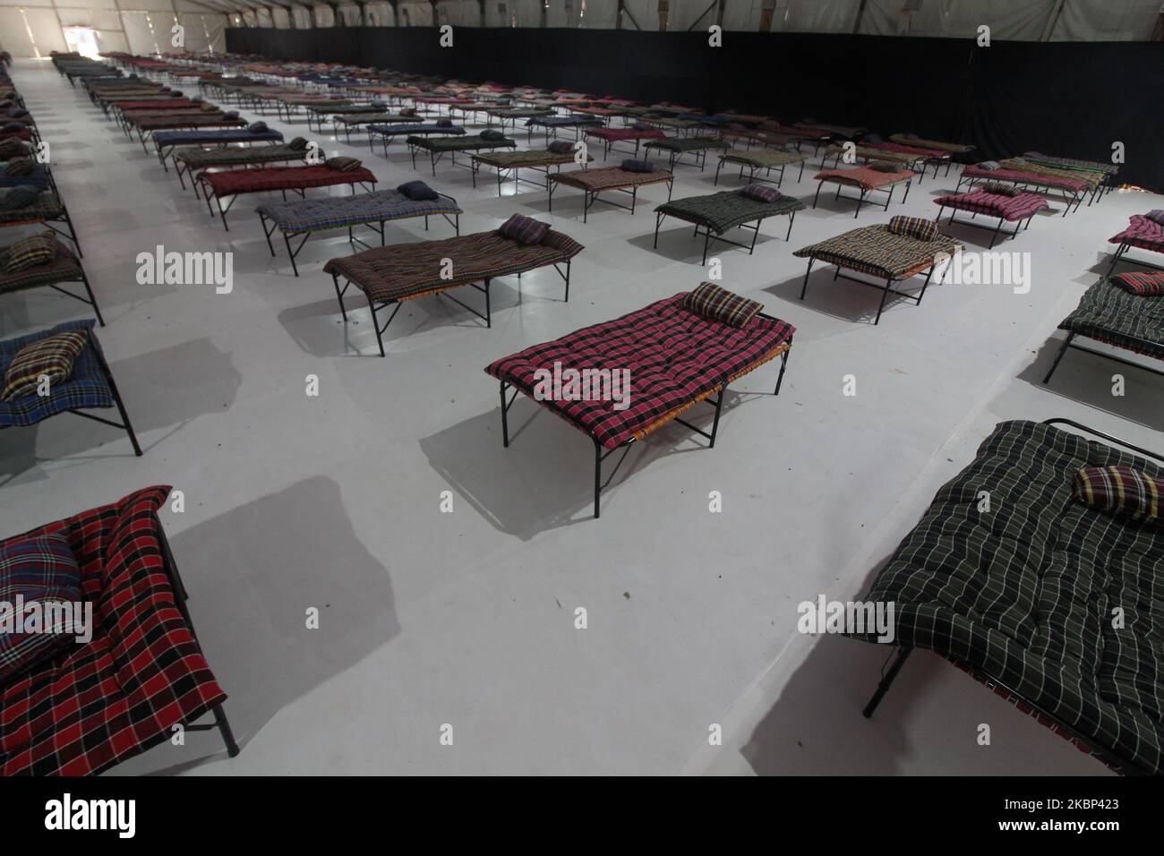 Beds are seen inside a makeshift isolation center for COVID-19 patients ...